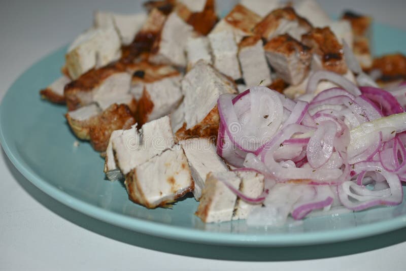 Fried Pieces of Delicious Pork Meat with Pickled Onions Stock Image ...
