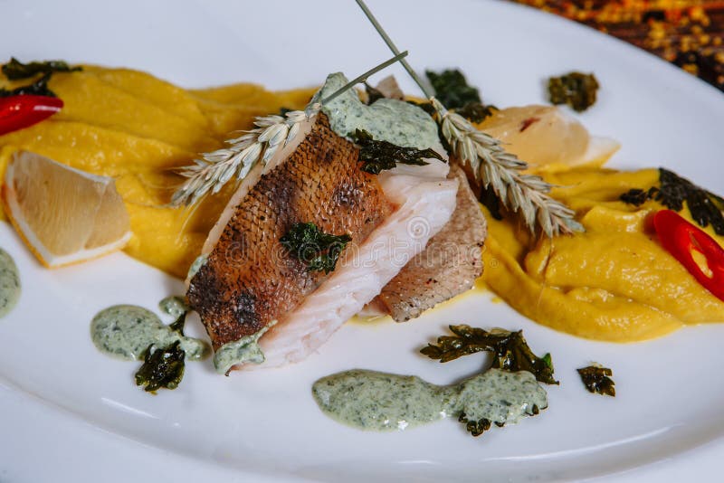 Fried Pike with a Side Dish of Pumpkin Puree Stock Image - Image of ...