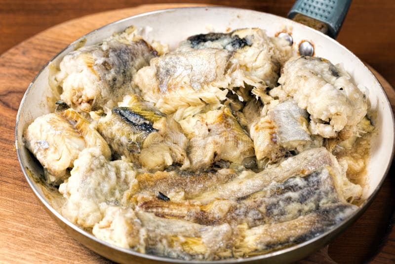 Fried pollock in the pan stock photo. Image of omega - 186806532