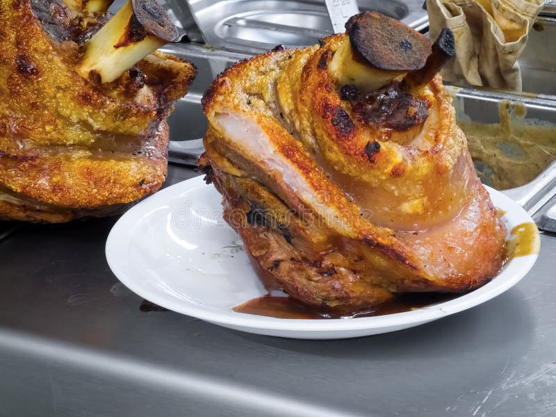 Fried Pork Knuckle on a Plate in the Kitchen of a Restaurant before ...