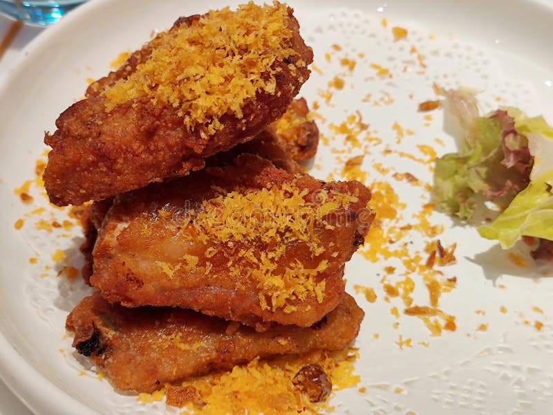 Fried Pork Rib with Fried Garlic Powder on the White Plate Stock Photo ...