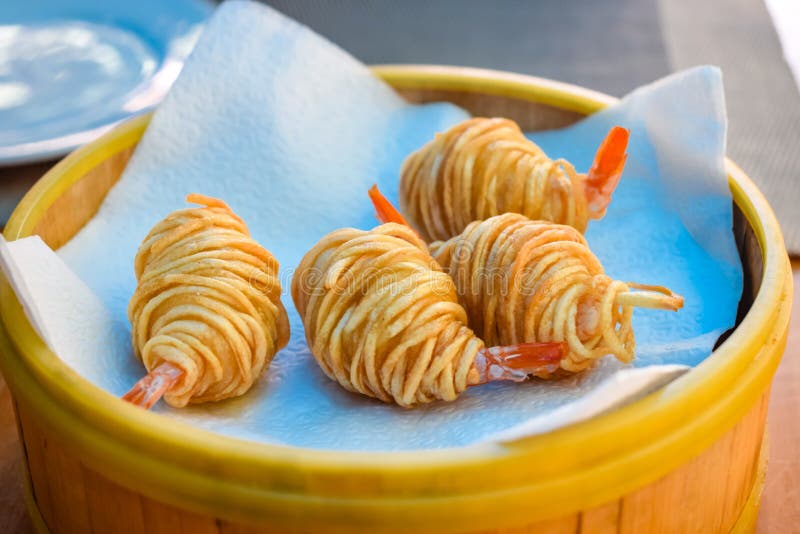 Fried Potato Wrapped Shrimps on Plate in Restaurant Stock Image - Image ...