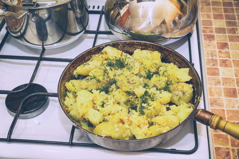 Fried Potatoes with Dill in a Pan on Gas Stove Stock Image - Image of ...