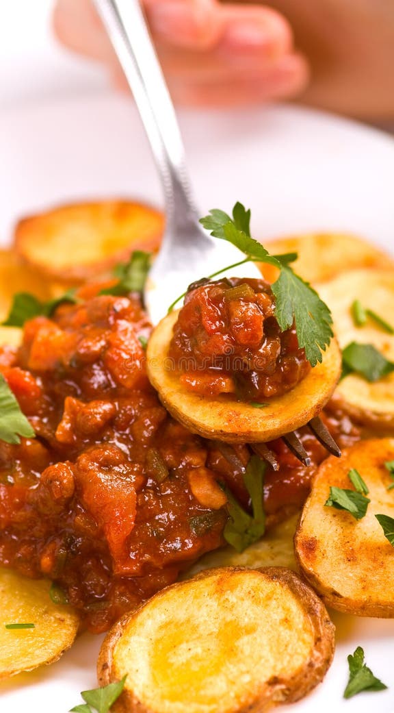 Fried Potatoes and Hand with a Fork Stock Image - Image of meat, brown ...