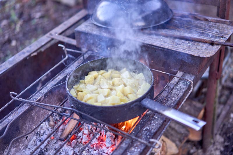 Fried Potatoes on an Open Fire Stock Photo - Image of wood, fried ...