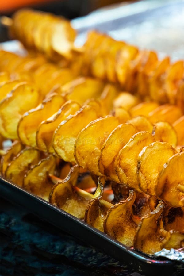 Fried Potatoes, a Slice of Vegetables Close-up on a Skewer Stock Photo ...