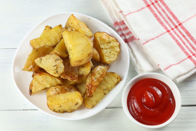 Fried Potatoes on a White Plate. Potato Dish in a Restaurant Stock ...
