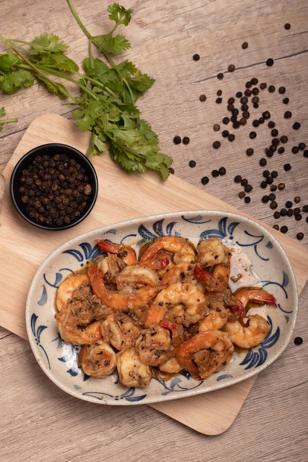 Fried Prawns with Black Pepper and Garlic in a White Plate Stock Photo ...