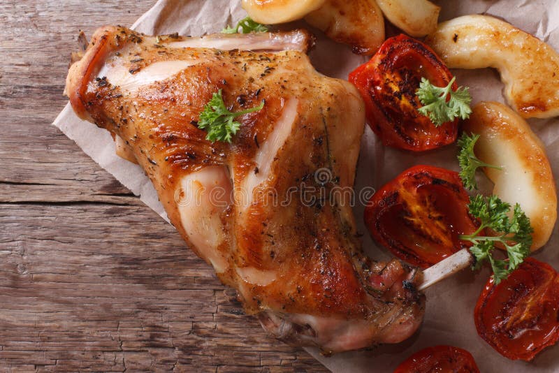 Fried Rabbit Leg with Apples and Tomatoes Top View Horizontal Stock ...