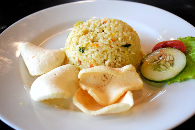 Fried Rice with Crackers and Slices of Cucumber, Tomato and Lettuce ...