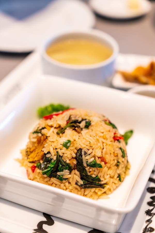 Fried Rice with Crispy Fish Stock Photo - Image of basil, meal: 149608996