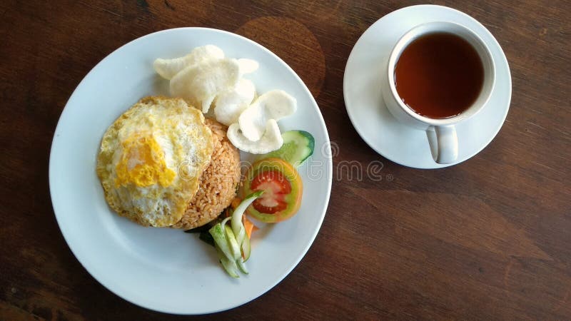 Fried Rice with Egg, Cucumber, Tomato, Pickles and Deep Fried Crackers ...