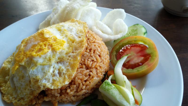 Fried Rice with Egg, Cucumber, Tomato, Pickles and Deep Fried Crackers ...