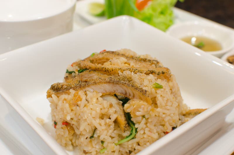 Fried rice with fried fish stock photo. Image of organic - 65535002