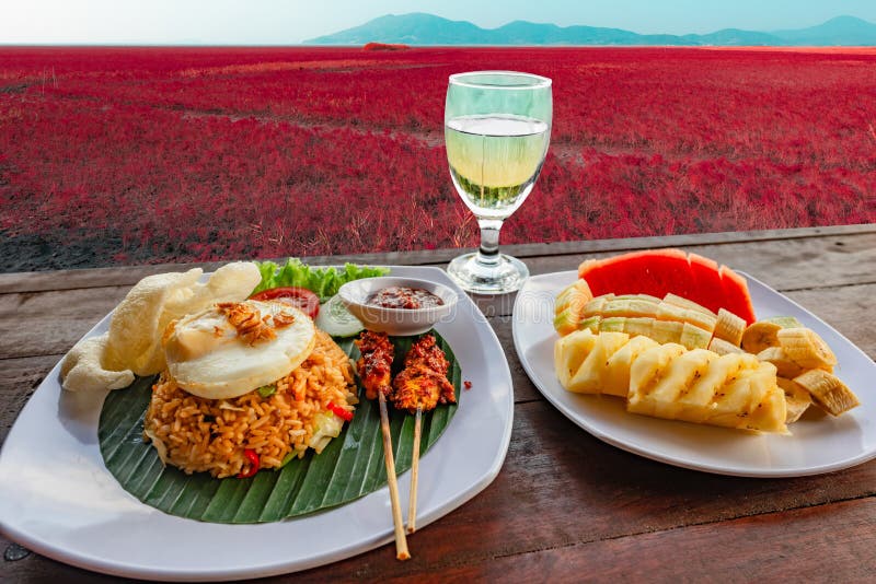 Fried Rice and Fruit on the Table Red Grassland Stock Image - Image of ...
