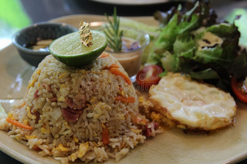 Fried Rice with Lime Decorated by Gold Leaf Stock Image - Image of ...
