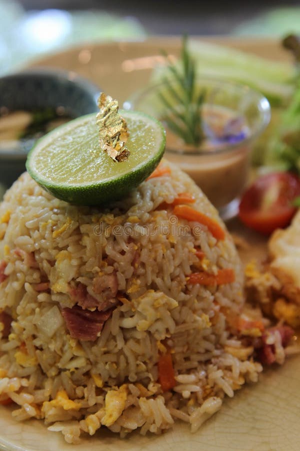 Fried Rice with Lime Decorated by Gold Leaf Stock Photo - Image of ...