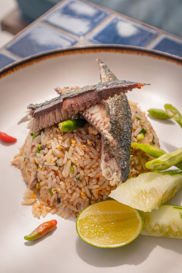 Fried Rice with Mackerel in Plate on Blue Tiled Surfac Stock Photo ...