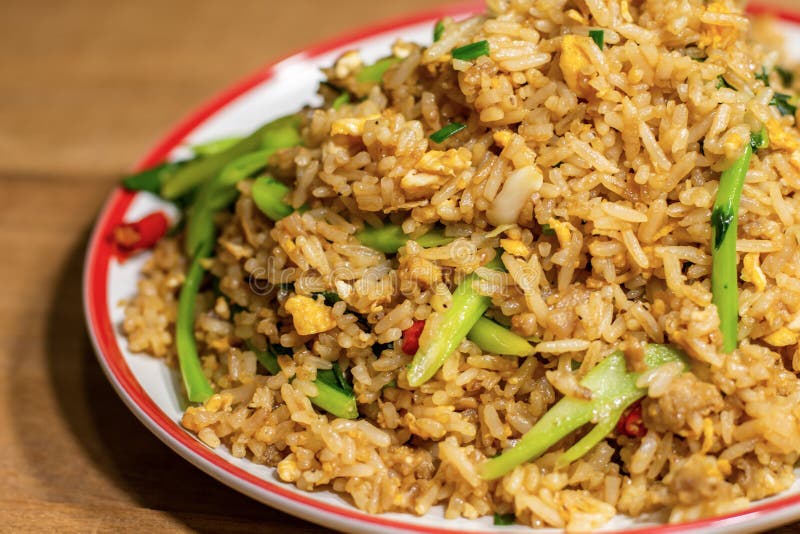Fried Rice Mix with Egg and Vegetable in White and Red Dish on Wooden ...