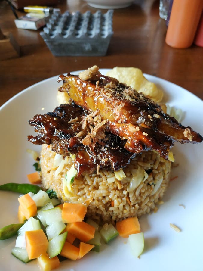 Fried rice with pork ribs stock photo. Image of fish - 262609324