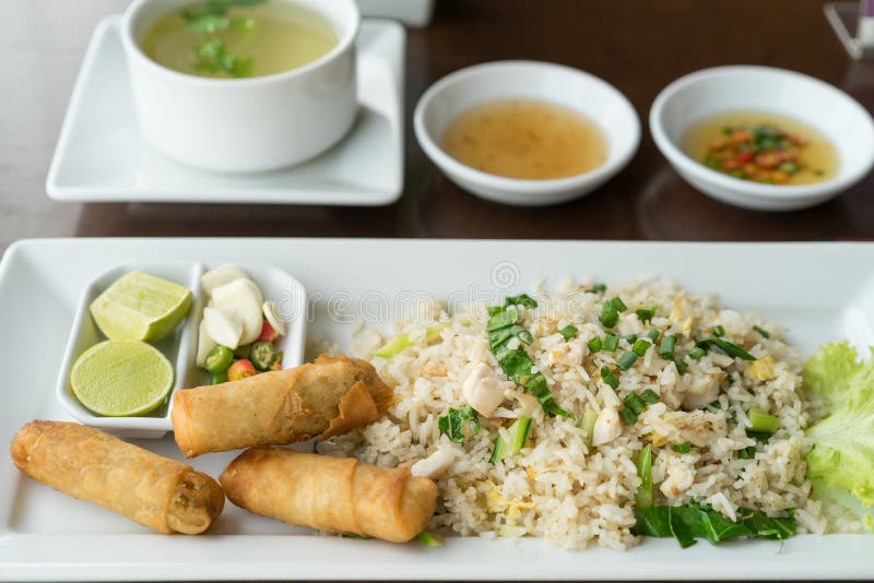 Fried Rice with Salted Fish and Fried Spring Rolls. Stock Photo - Image ...