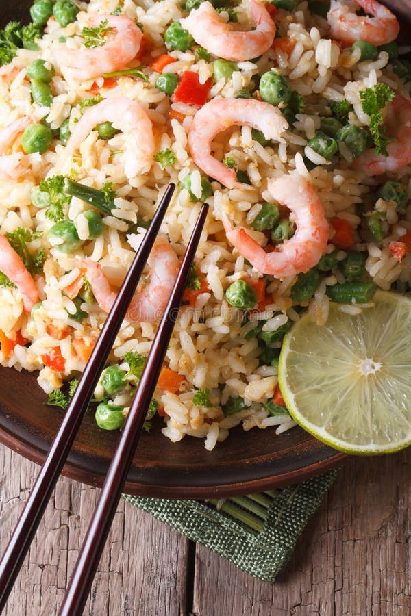 Fried Rice with Shrimp and Vegetables and Chopsticks. Vertical Stock ...