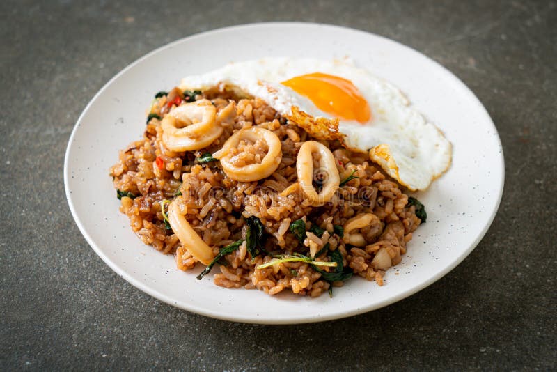 Fried Rice with Squid and Basil Topped Fried Egg in Thai Style Stock ...