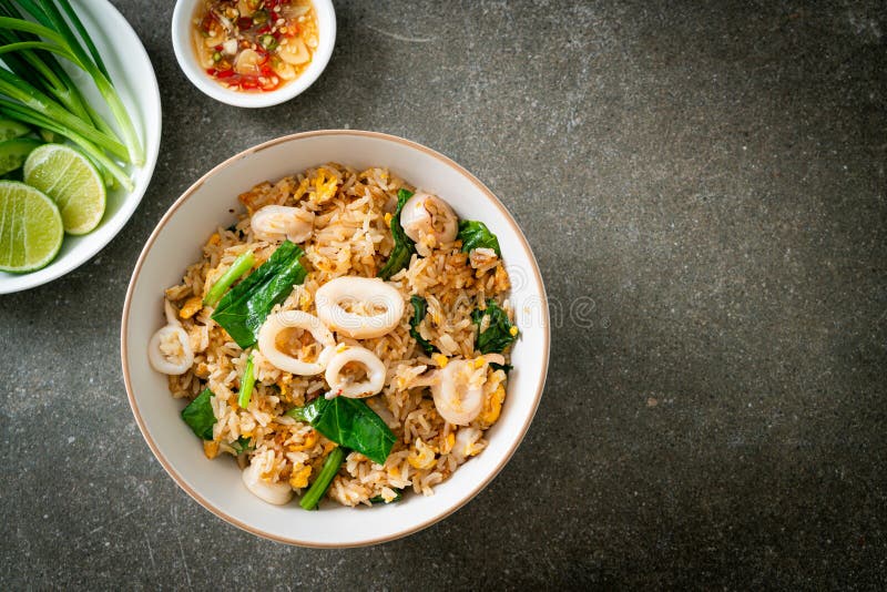 Fried Rice with Squid or Octopus Stock Photo - Image of plate, rice ...