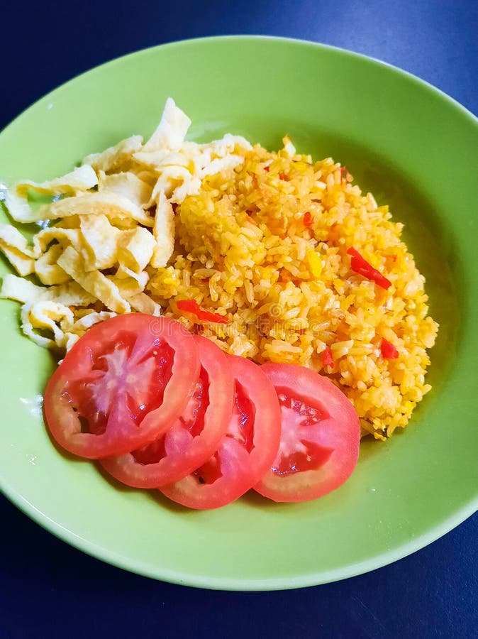 Fried Rice with Tomato and Fried Egg Topping Stock Photo - Image of ...