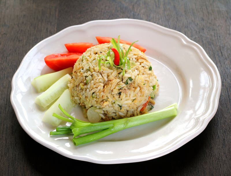 Fried Rice in White Ceramic Plate on Wood Table Stock Image - Image of ...