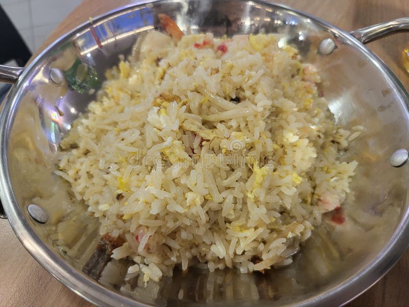 Fried rice in a wok stock photo. Image of lunch, food - 275674618