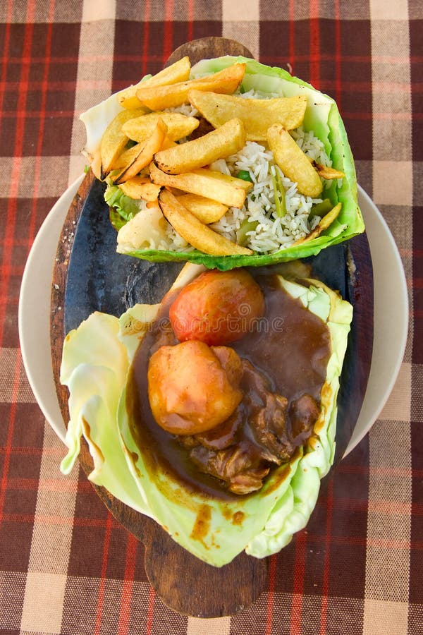 Fried Rise and Potatoes with Vegetables and Fish Stock Image - Image of ...