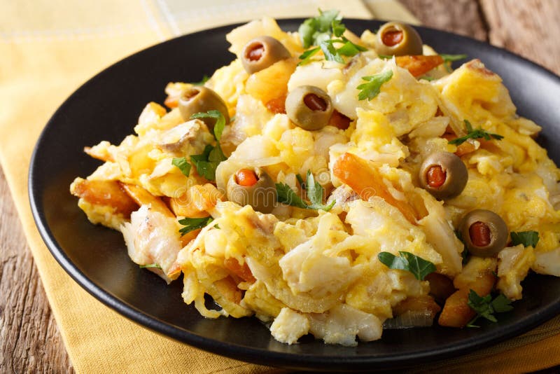 Fried Salted Cod with Potatoes, Onions and an Omelette on a Plat Stock ...