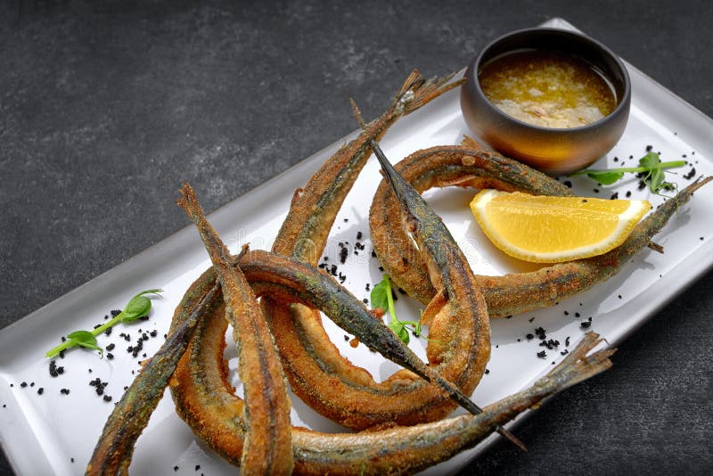 Fried Sargan Fish on a Plate with Sauce Stock Photo - Image of ...