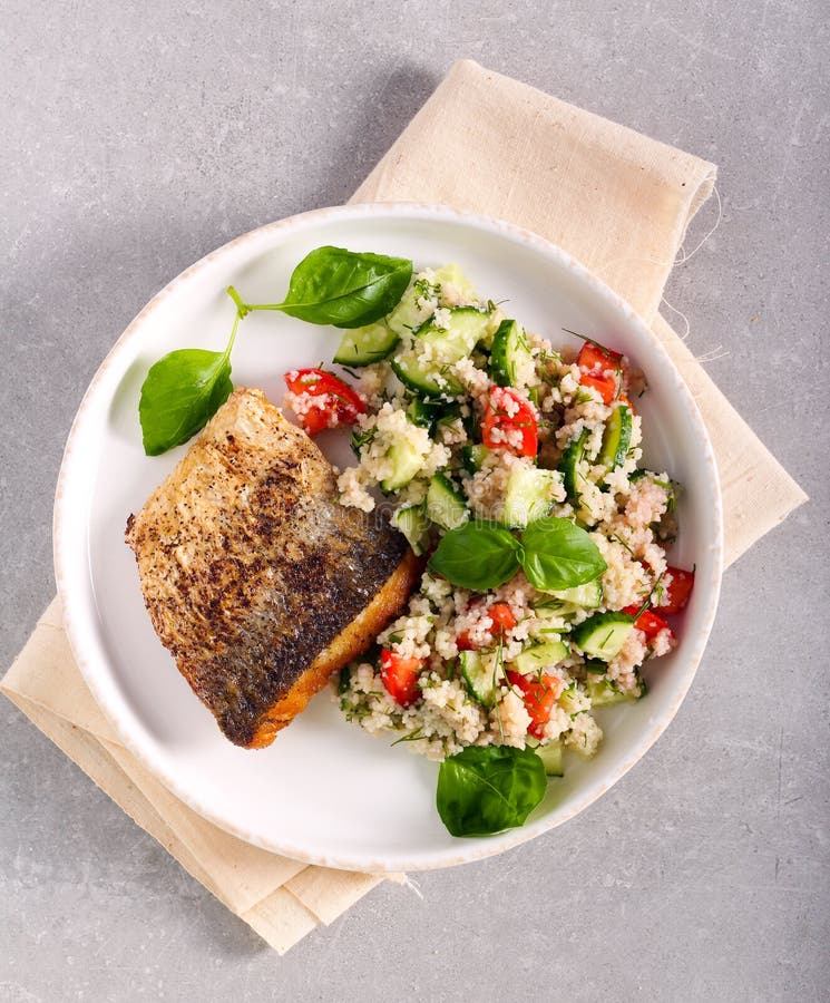Fried Sea Bass Fish and Salad Stock Photo - Image of food, fish: 198580654