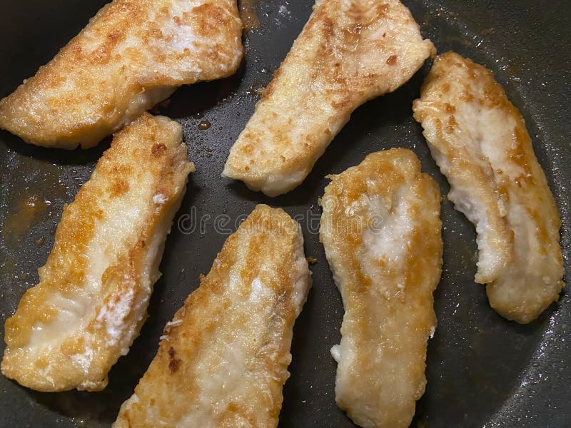 Fried Seabass Fillets in the Pan Stock Photo - Image of cooking ...
