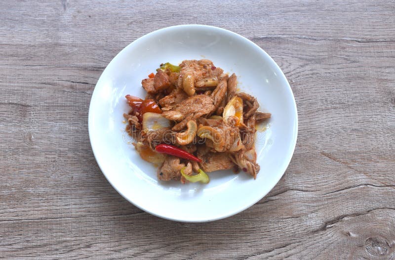 Fried Slice Chicken Meat with Cashew Nut and Red Chili on Plate Stock ...
