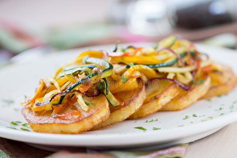Fried Slices of Potato with Finely Chopped Sticks Vegetables Stock ...