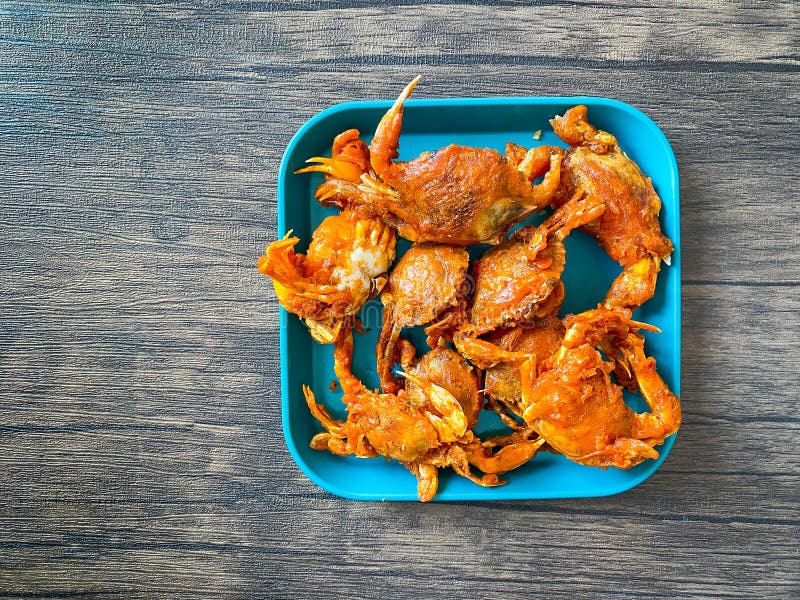 Fried small crab on a wood stock photo. Image of hungry - 264124440
