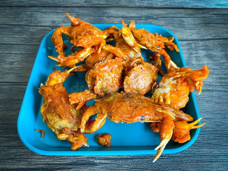 Fried small crab on a wood stock image. Image of restaurant - 264124535