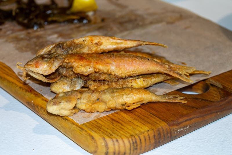 Fried small fish stock photo. Image of plate, trout - 180322798