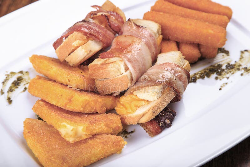 Fried snacks stock image. Image of garnish, orange, board - 86080071