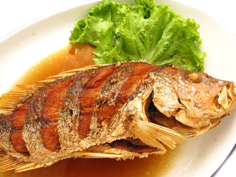Fried Snapper Belly with Spicy Garlic Soy Sauce Stock Photo - Image of ...