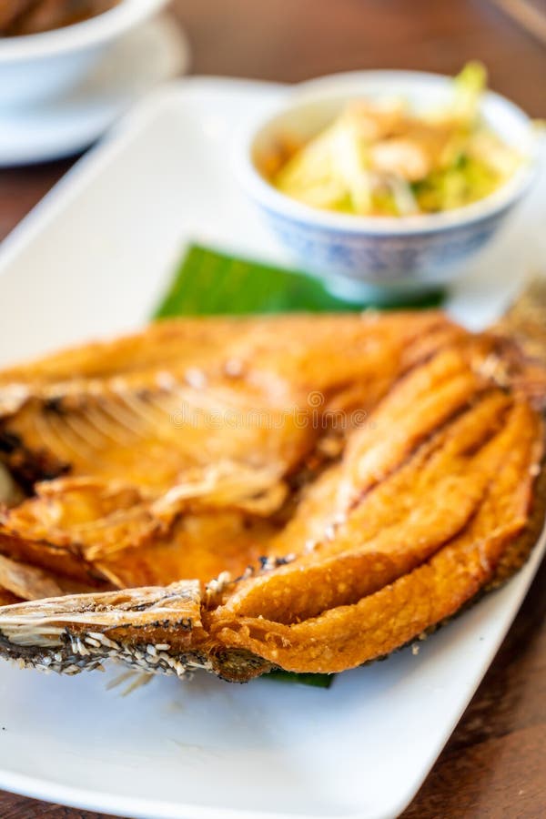 Fried Snapper Belly with Spicy Garlic Soy Sauce Stock Photo - Image of ...