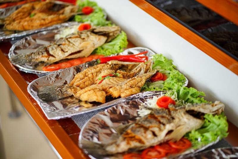 Fried snapper salt fish stock image. Image of sauce - 114767803