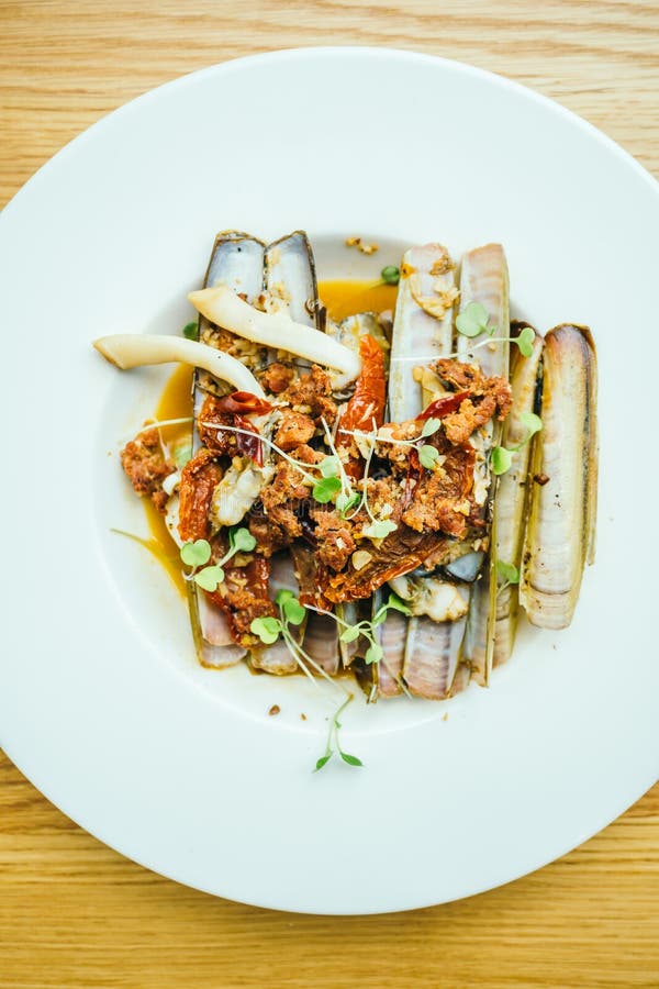 Fried spicy razor clams stock photo. Image of studio - 97475018