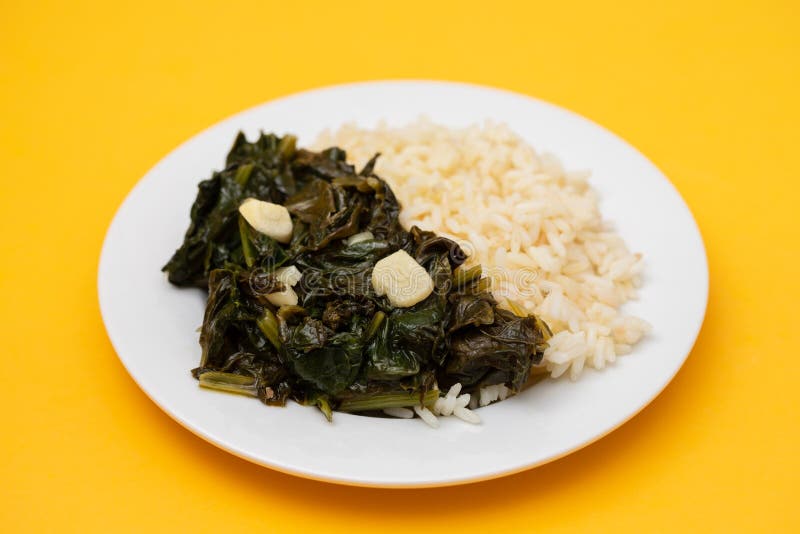 Fried Spinach with Garlic and Boiled Rice on Plate Stock Photo - Image ...