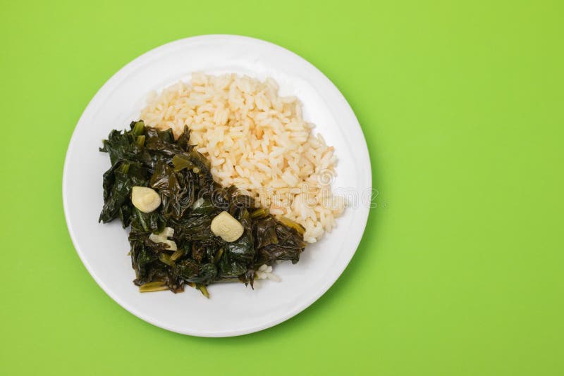 Fried Spinach with Garlic and Boiled Rice on Plate Stock Image - Image ...