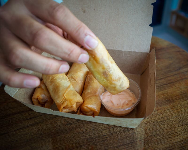 Fried Spring Rolls in a Brown Takeaway Container with Creamy Sauce ...