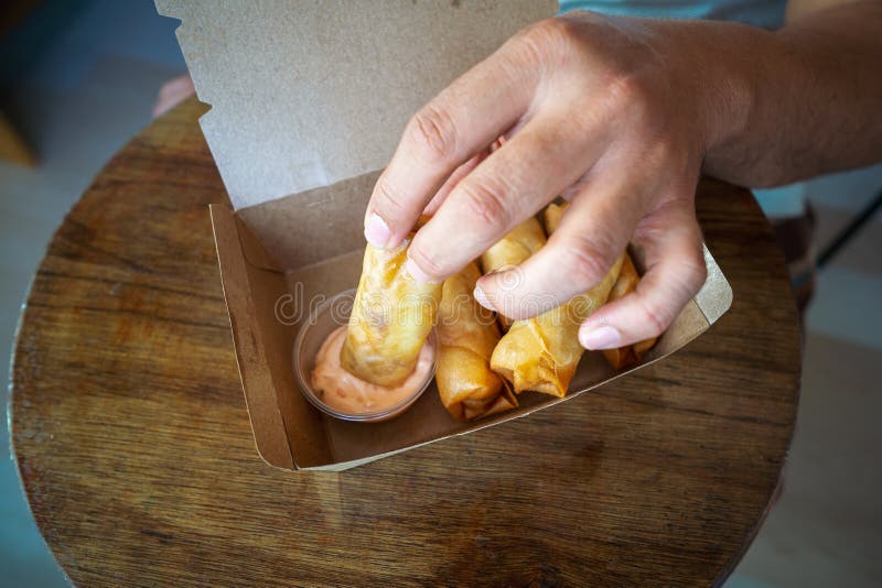 Fried Spring Rolls in a Brown Takeaway Container with Creamy Sauce ...